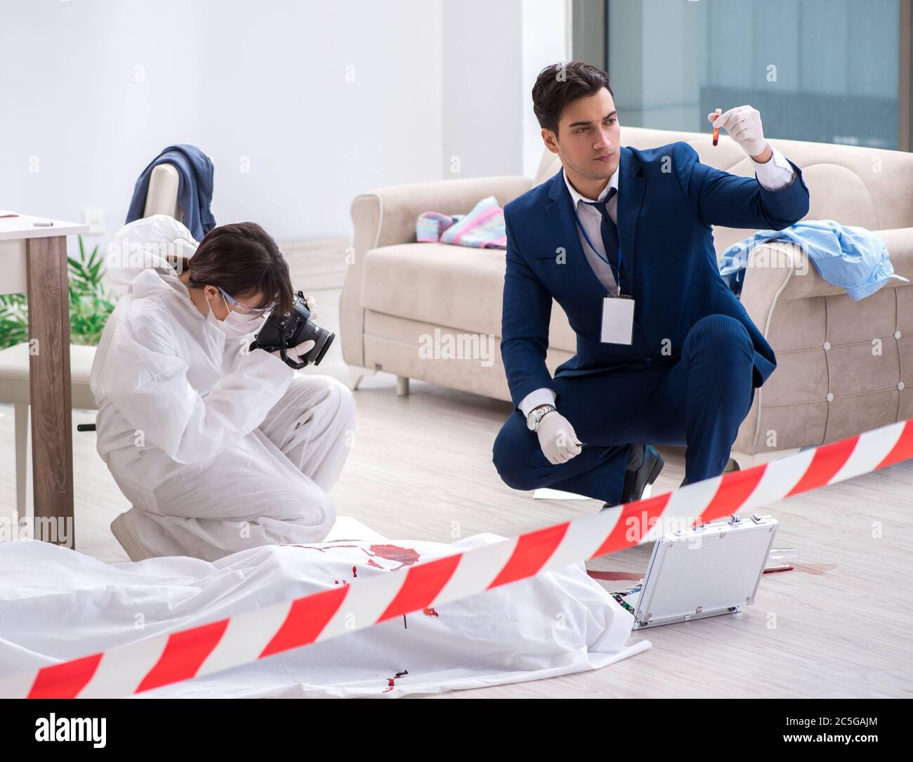 The forensics investigator at the scene of office crime Stock Photo - Alamy