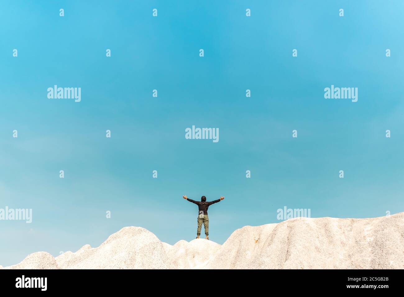 Man rise hands up to sky freedom concept with copyspace blue sky ...