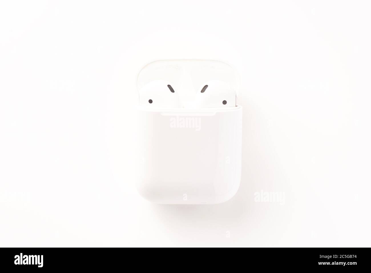 Modern wireless earphones charging Cut Out Stock Images & Pictures - Alamy