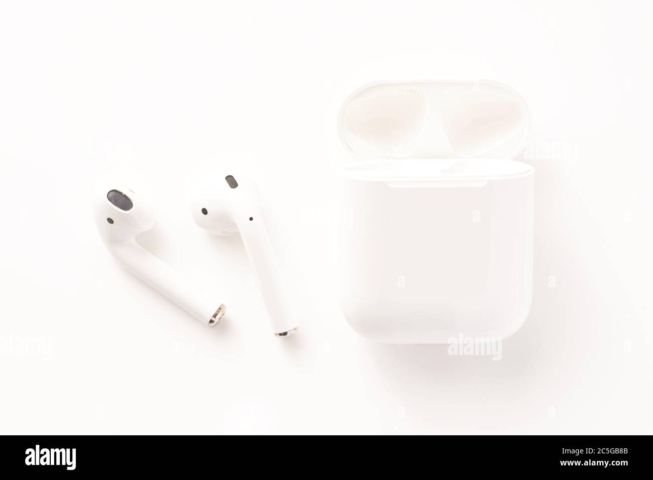 Modern wireless earphones charging Cut Out Stock Images & Pictures - Alamy