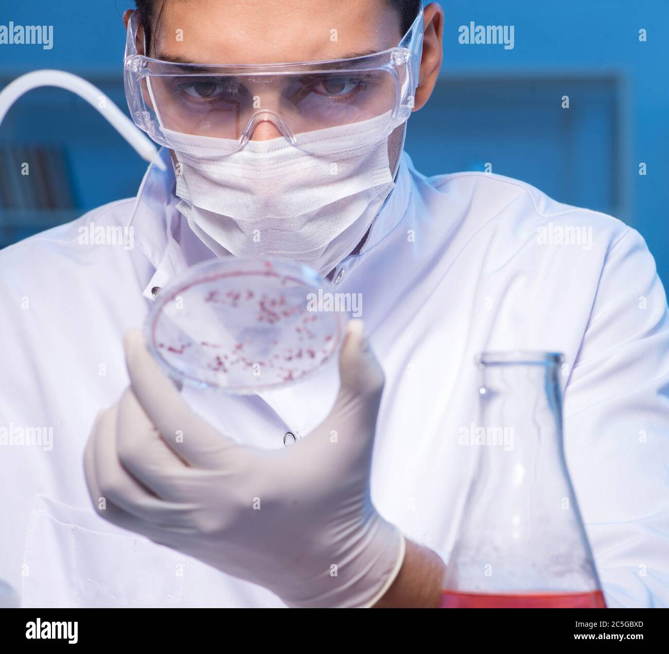 The doctor researching new virus in lab at night Stock Photo - Alamy