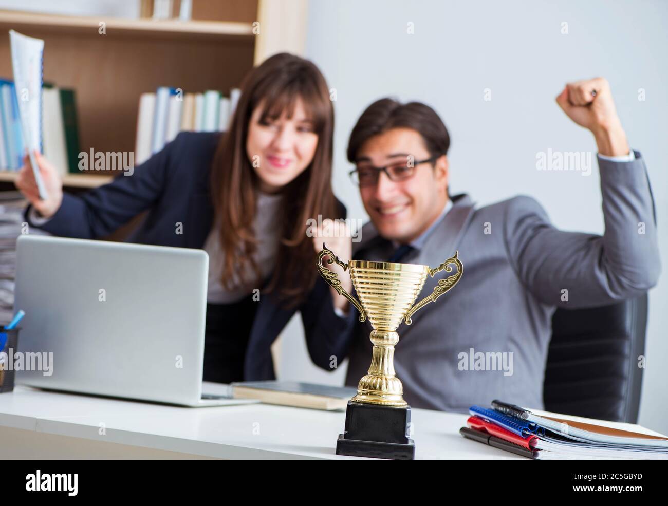 The concept of teamwork with prize Stock Photo - Alamy