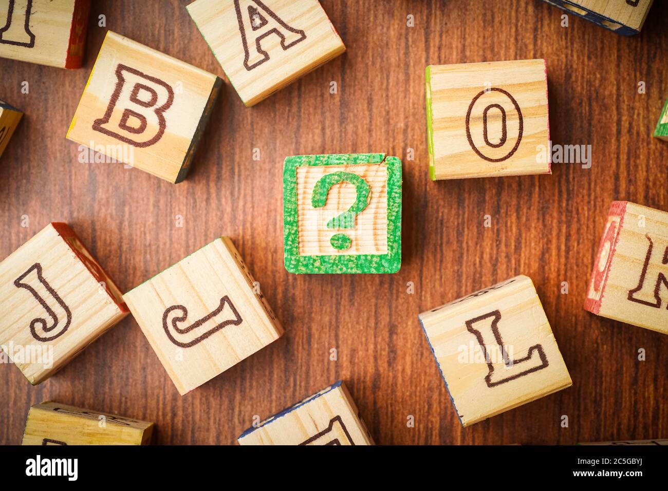 A question mark symbol on wooden block, symbolize options and ...