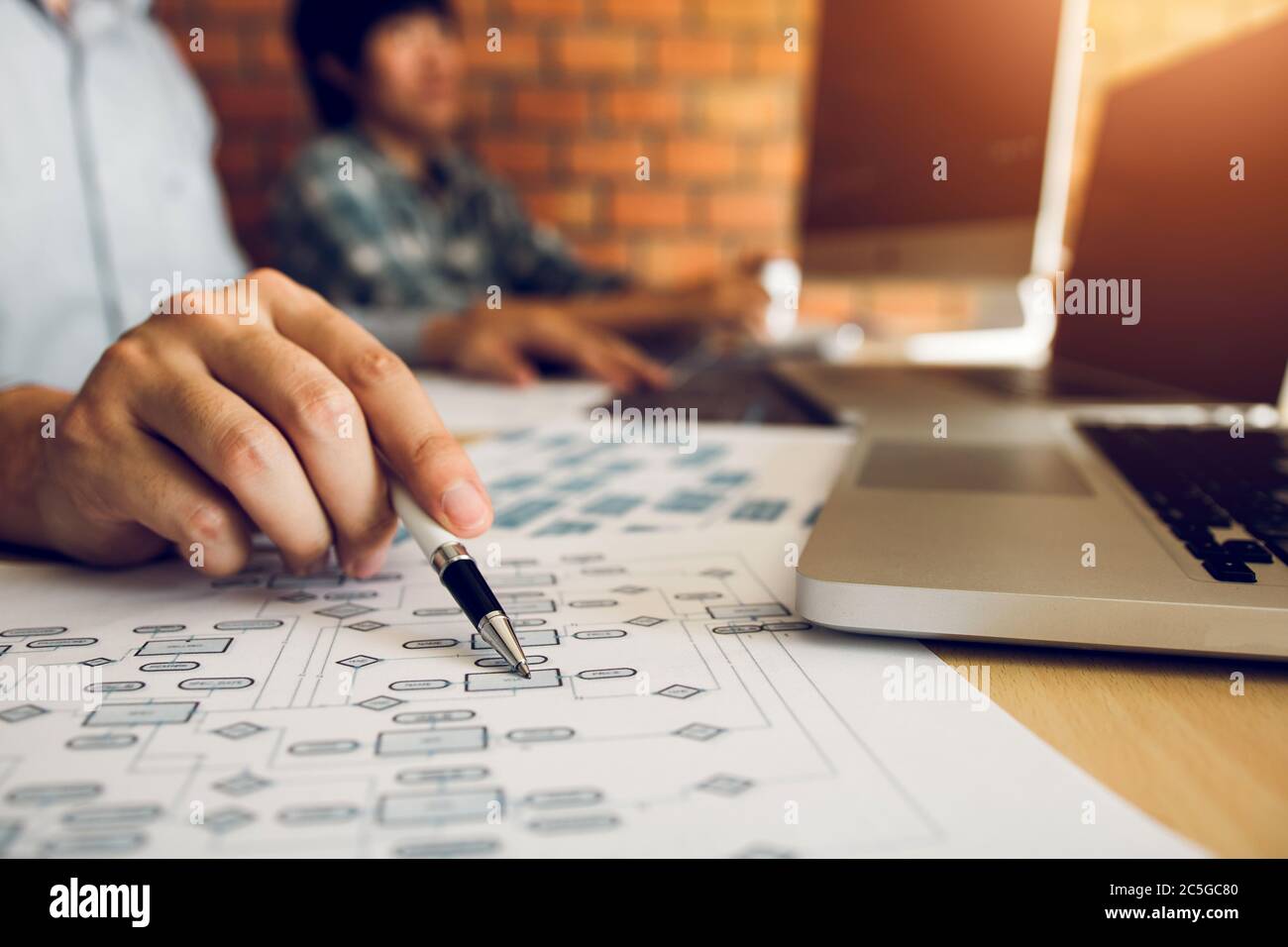 Programmer man pointing pen html hi-res stock photography and images ...