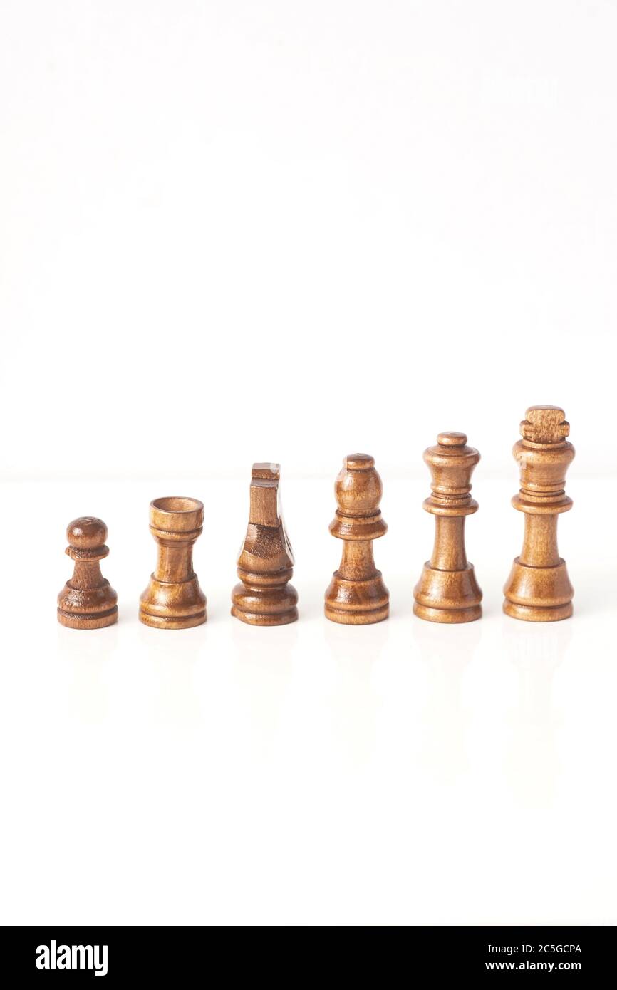 wooden chess pieces isolated against white Stock Photo - Alamy