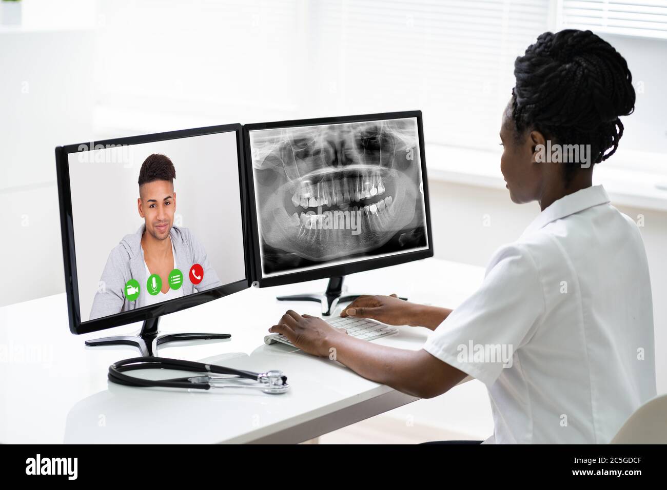 African Doctor In Video Conference Call Talking With Patient Stock ...