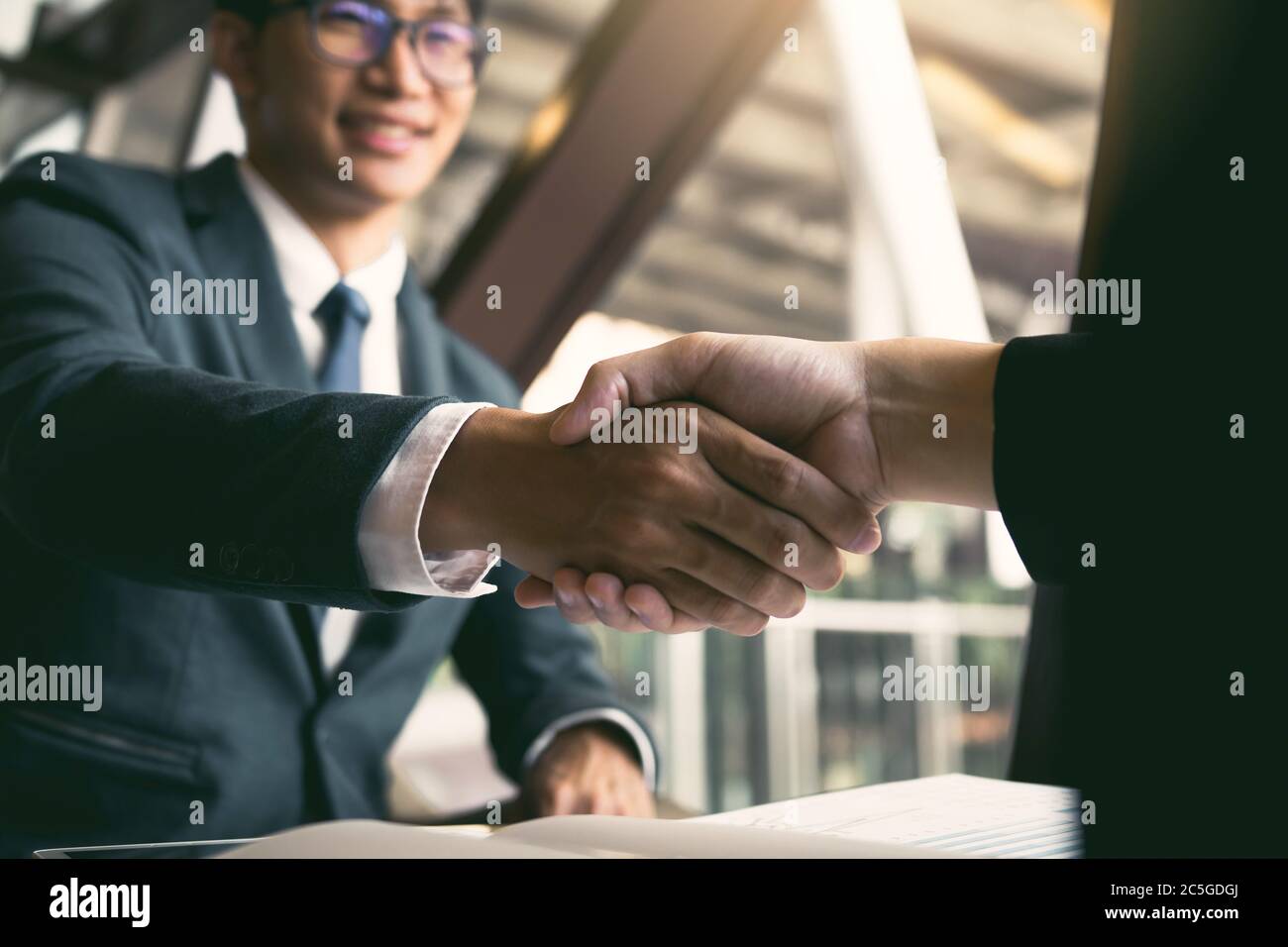 Two businessmen are talking and making deals on business operations and ...