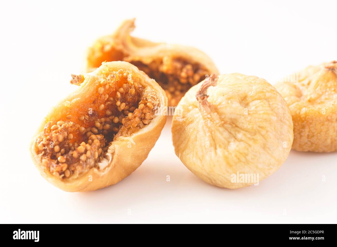 Dried figs isolated against white Stock Photo - Alamy