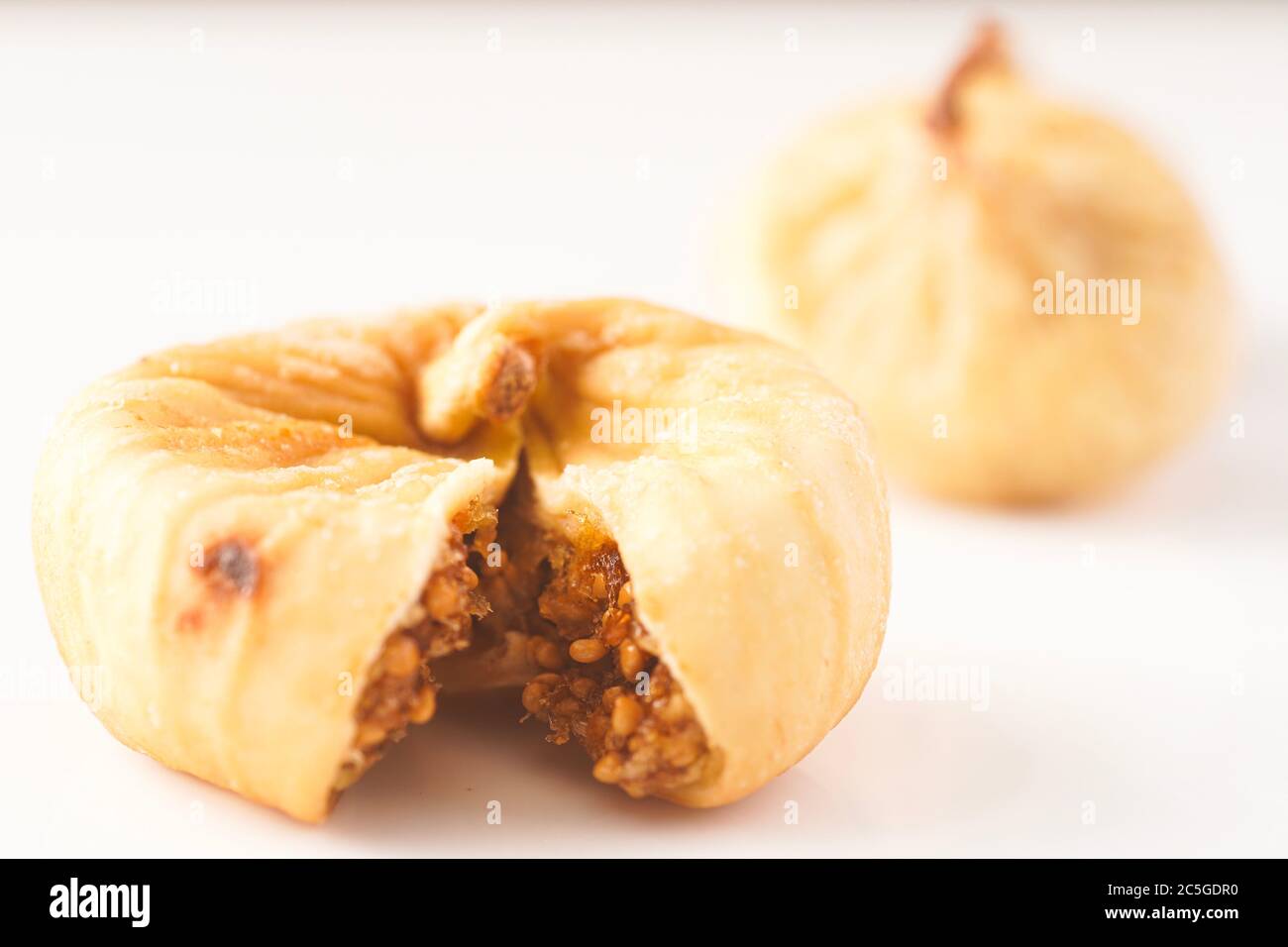Dried figs isolated against white Stock Photo - Alamy