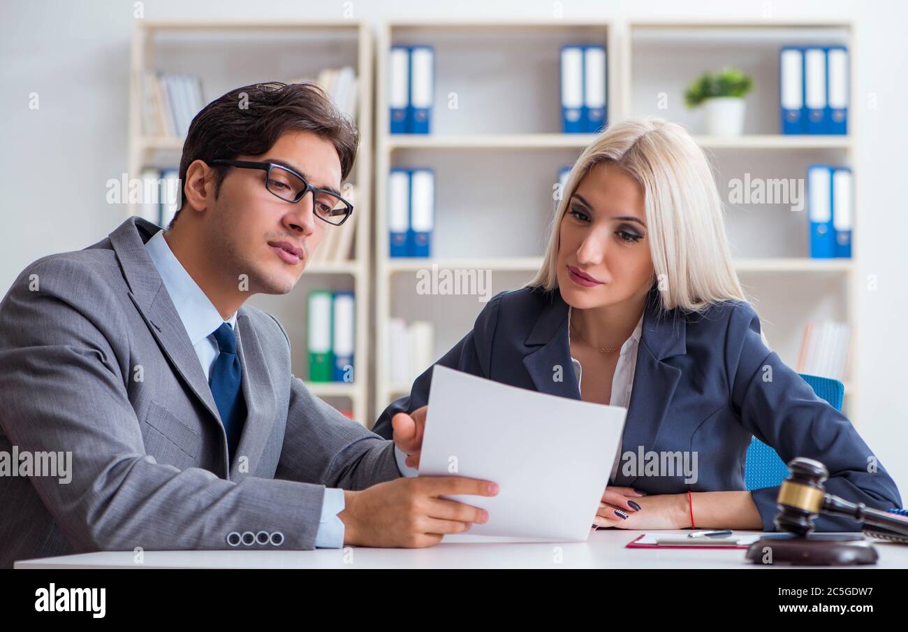 The lawyer discussing legal case with client Stock Photo - Alamy