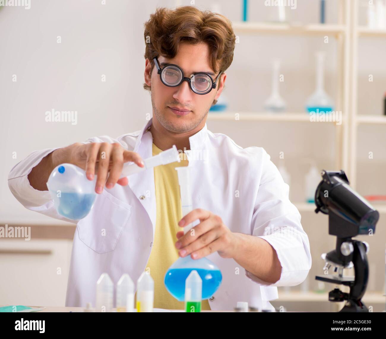 The funny crazy chemist doing experiments and tests Stock Photo - Alamy