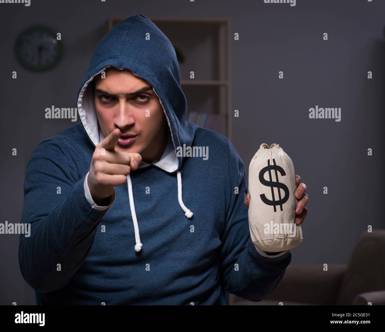 The hacker with sack of money Stock Photo - Alamy