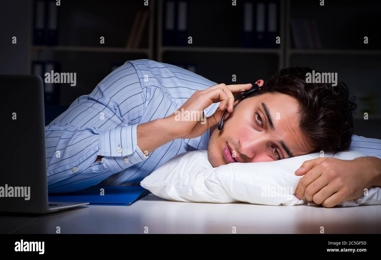 The tired and exhausted helpdesk operator during night shift Stock ...