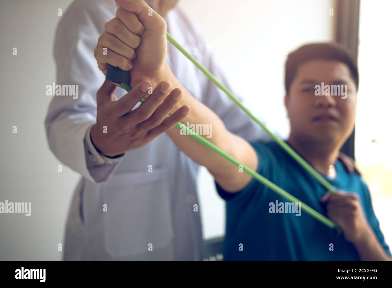 Close up hand patient doing stretching exercise with a flexible ...