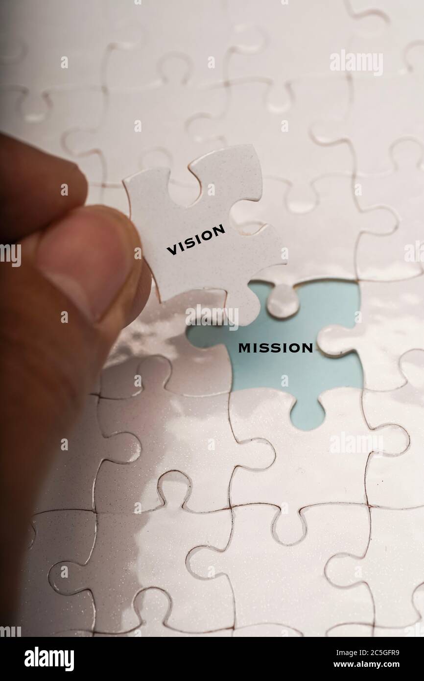 Business management concept: vision and mission wordings on puzzle ...