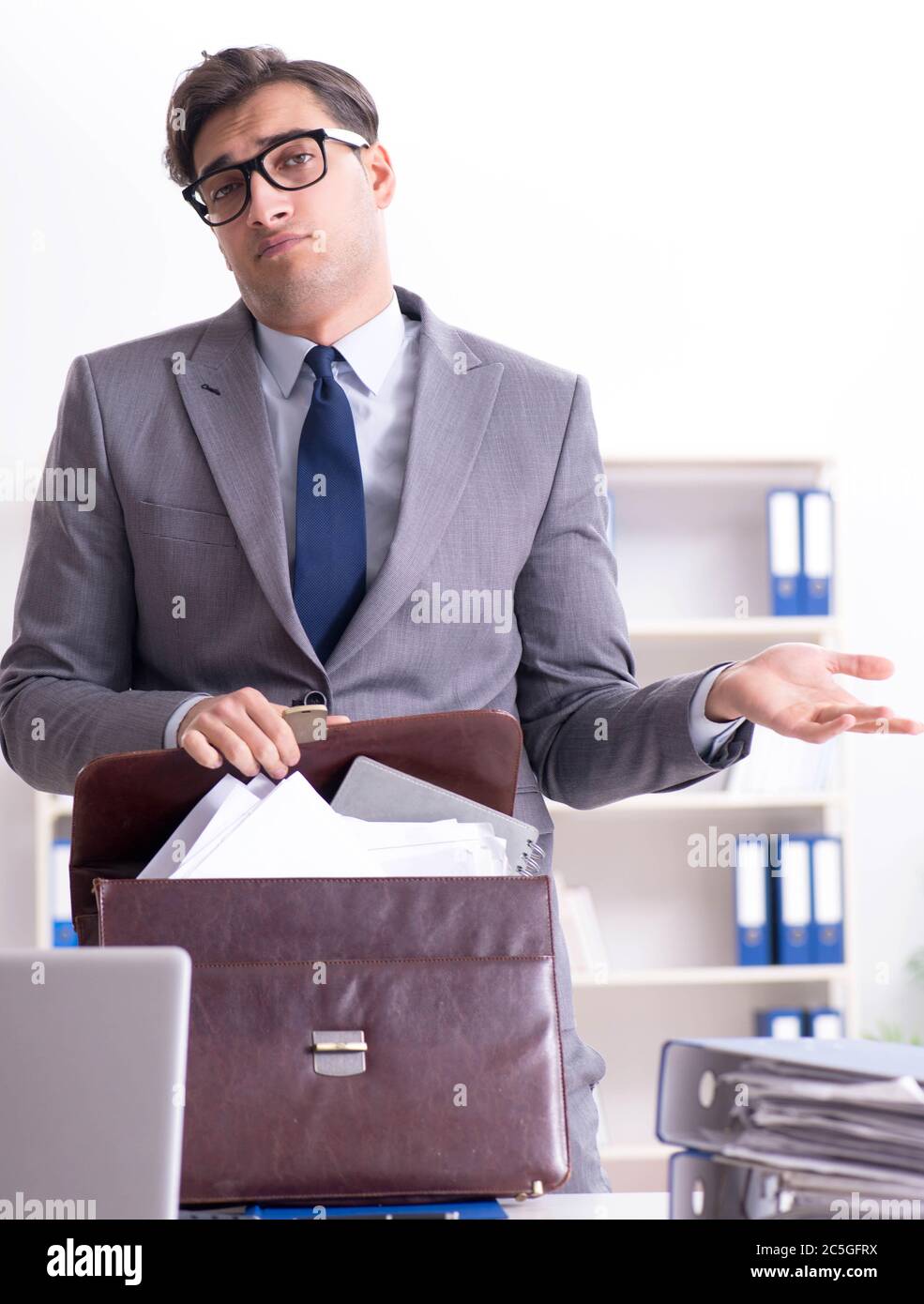 The employee with too much work taking it home Stock Photo - Alamy
