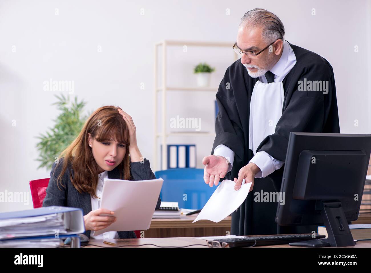 Old judge and his young secretary in the office Stock Photo - Alamy