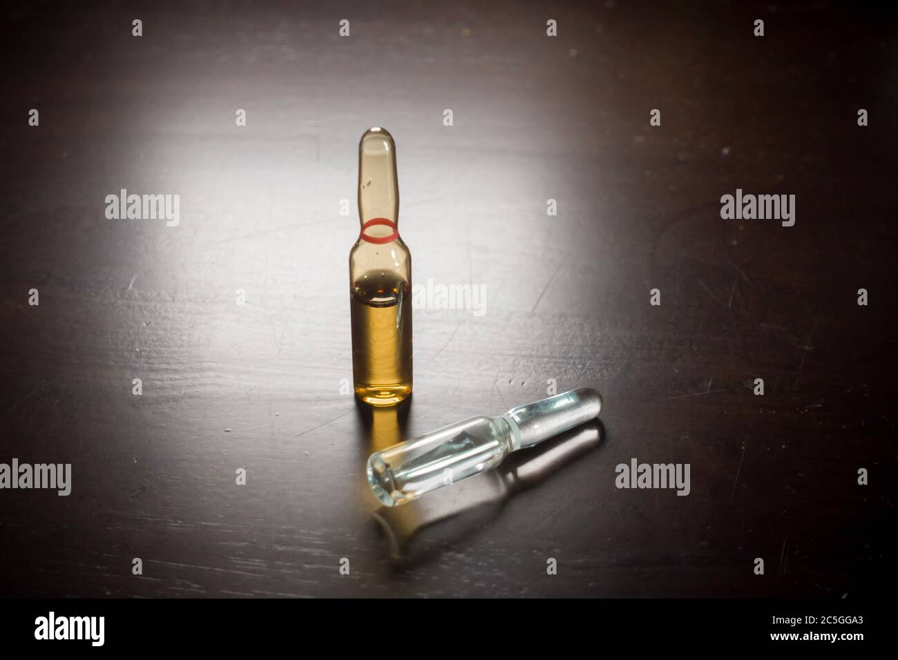 Medication ampoules for Intravenous injections on wooden background ...