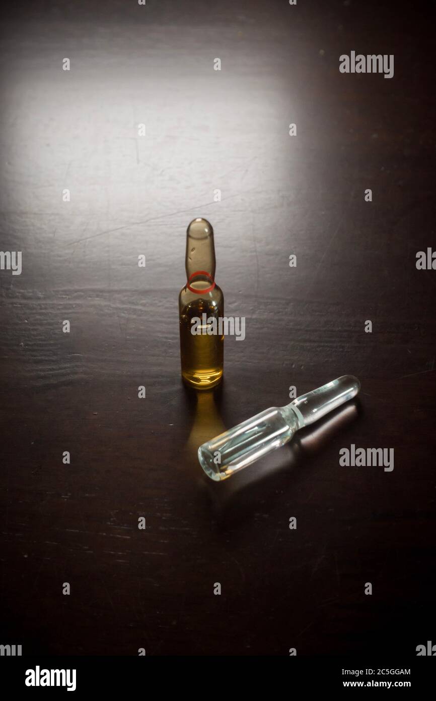 Medication ampoules for Intravenous injections on wooden background ...