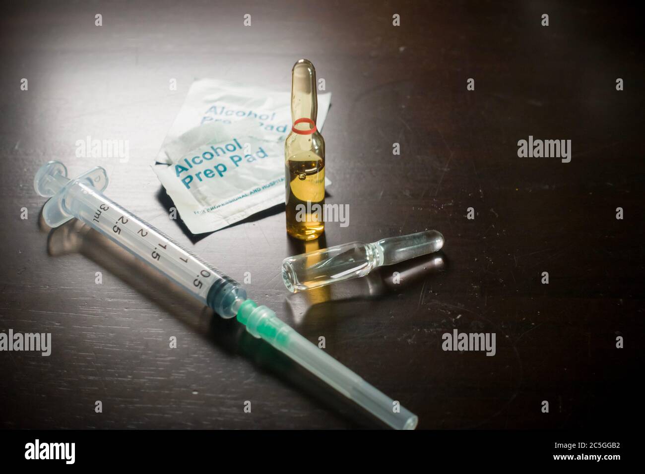 Medication ampoules for Intravenous injections on a wooden background ...