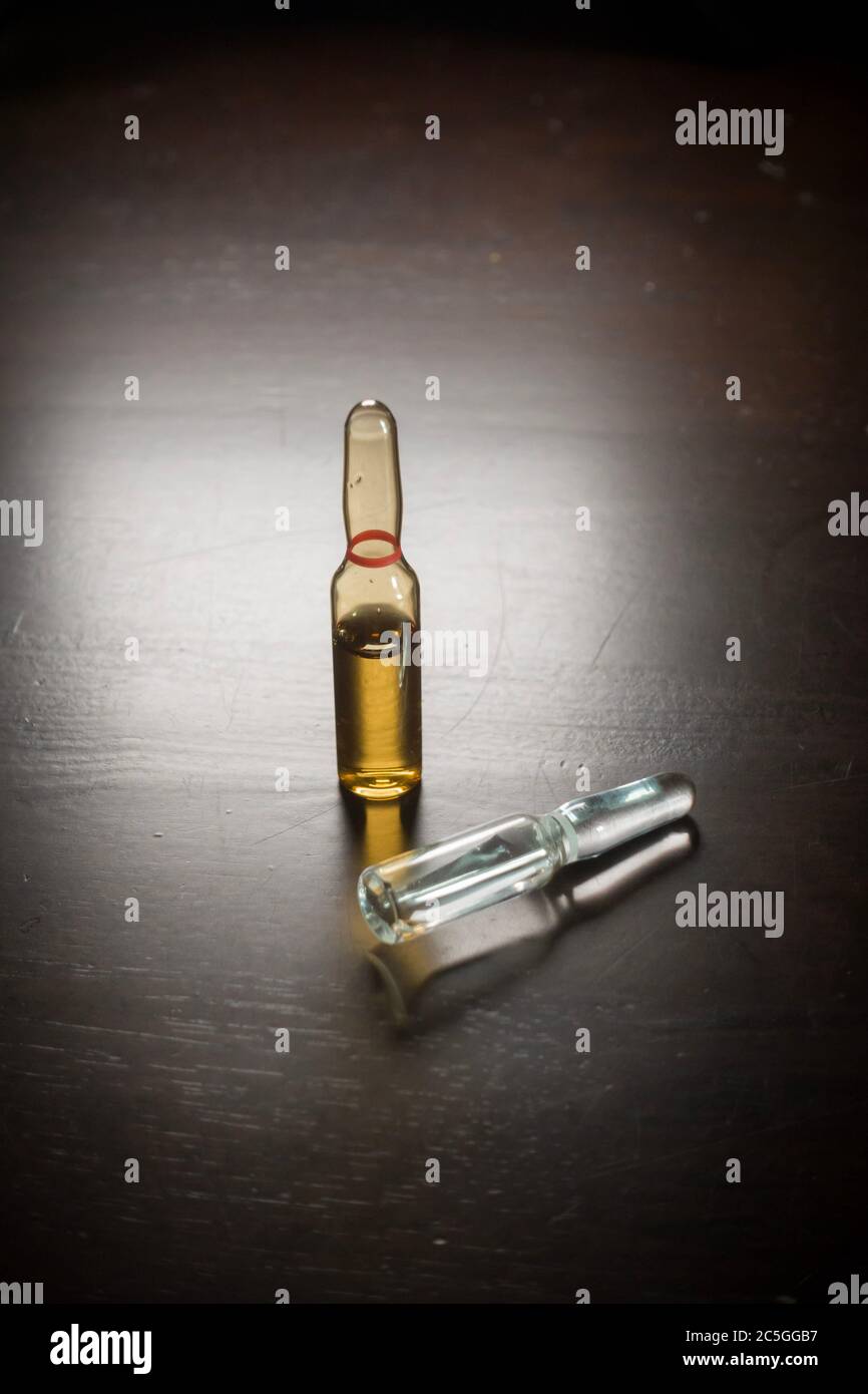 Medication ampoules for Intravenous injections on wooden background ...