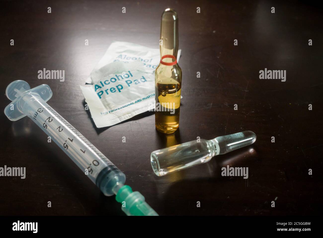 Medication ampoules for Intravenous injections on a wooden background ...