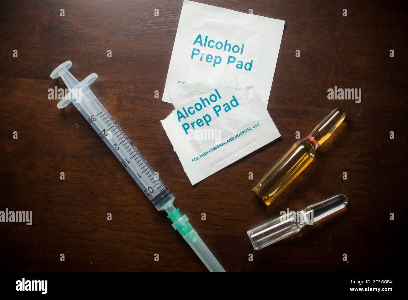 Medication ampoules for Intravenous injections on a wooden background ...