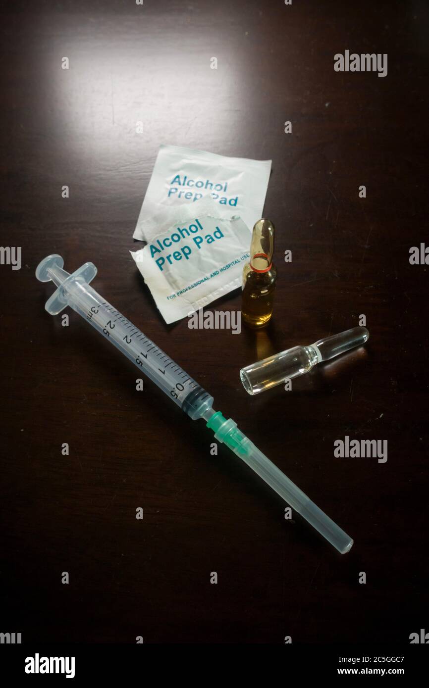 Medication ampoules for Intravenous injections on a wooden background ...