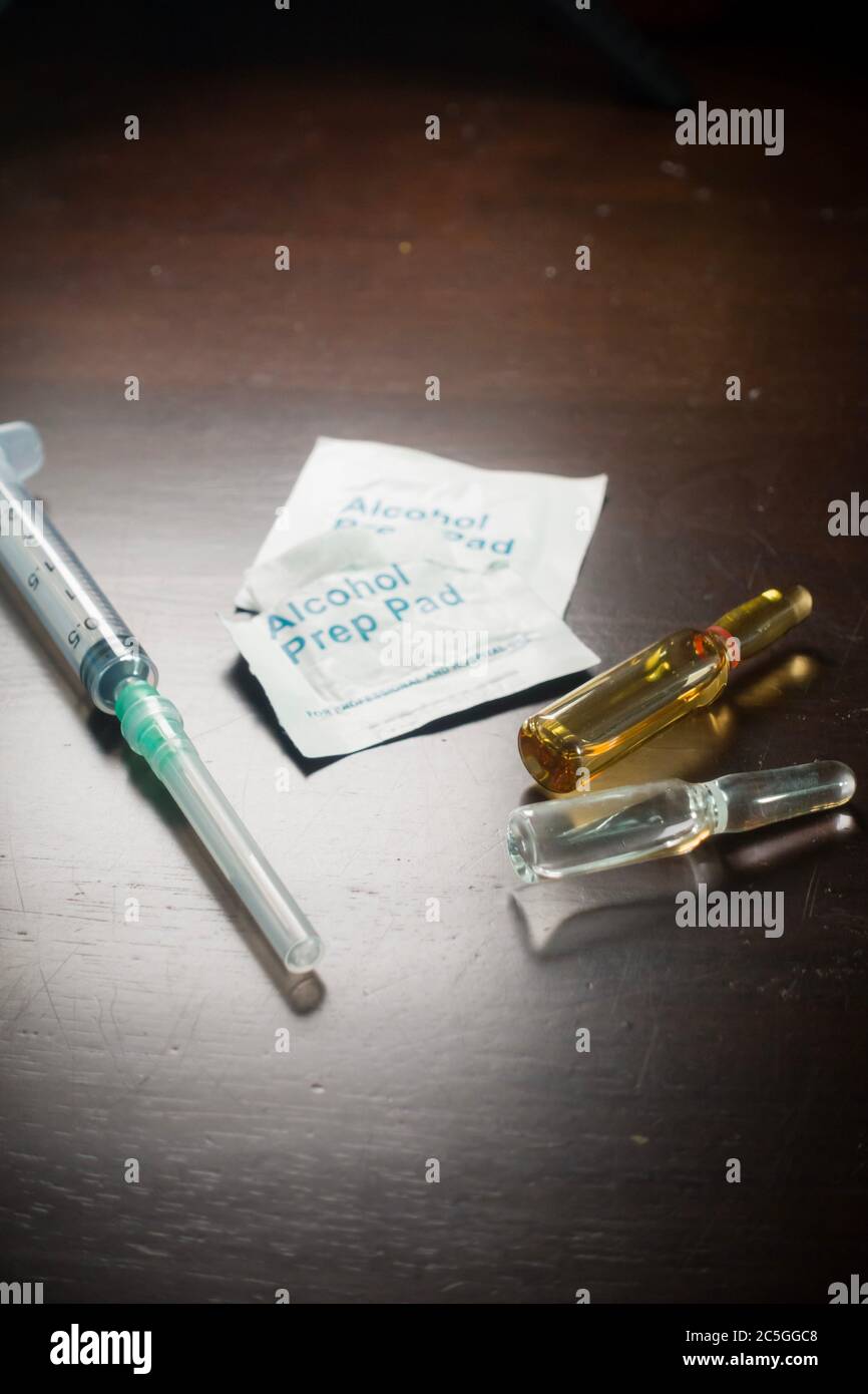 Medication ampoules for Intravenous injections on a wooden background ...
