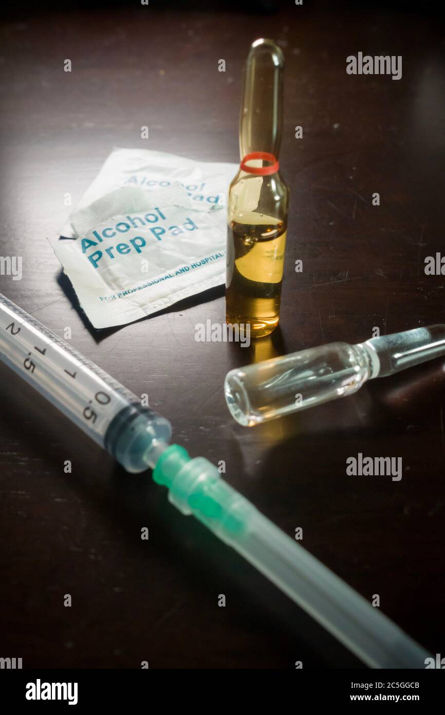 Medication ampoules for Intravenous injections on a wooden background ...