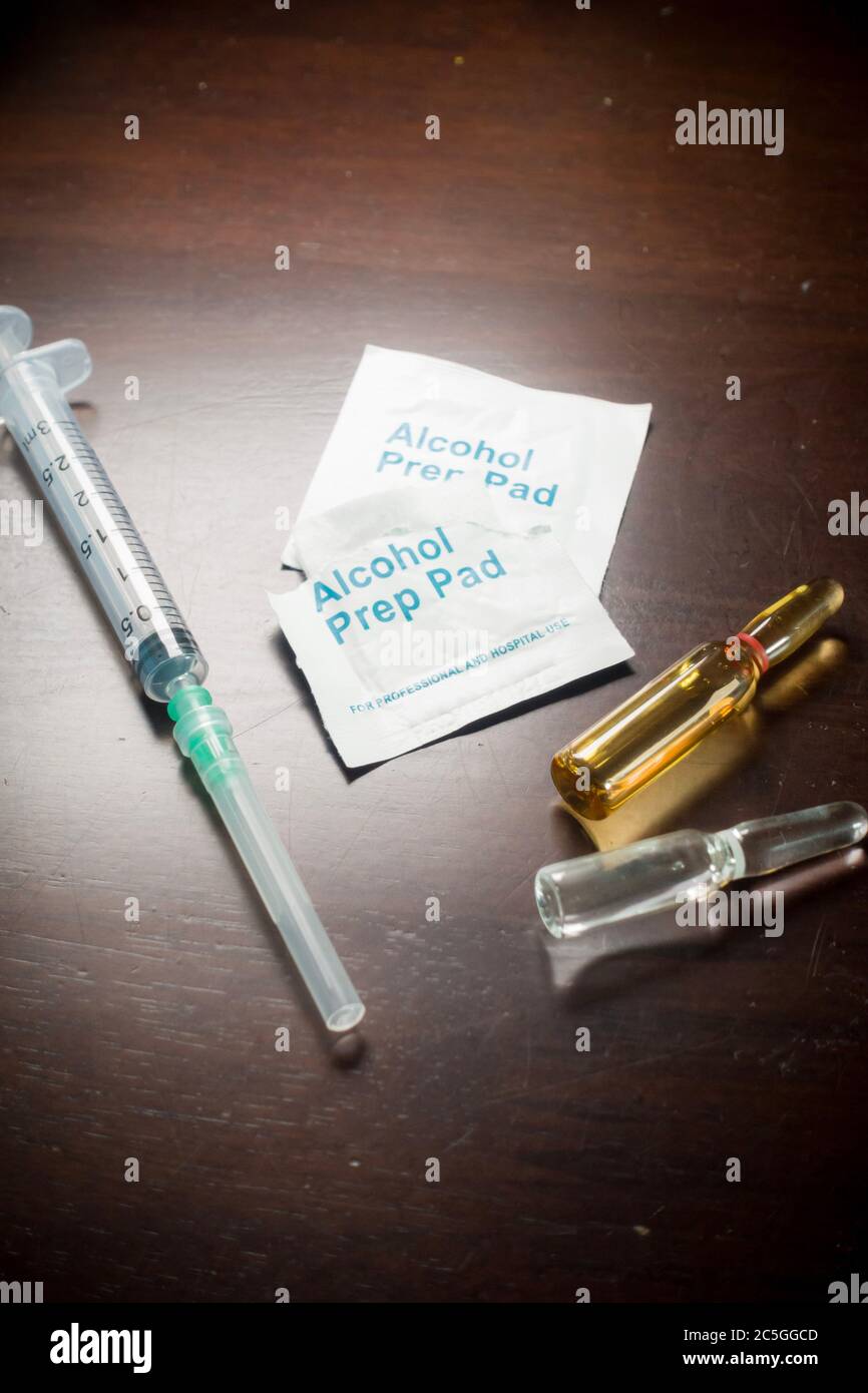 Medication ampoules for Intravenous injections on a wooden background ...