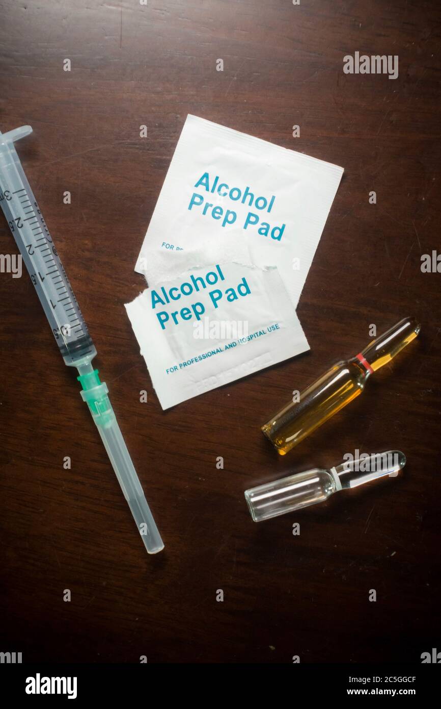 Medication ampoules for Intravenous injections on a wooden background ...