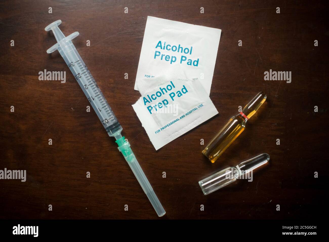 Medication ampoules for Intravenous injections on a wooden background ...