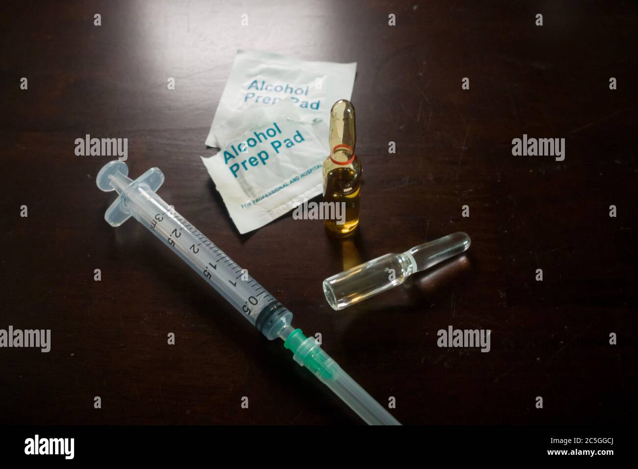 Medication ampoules for Intravenous injections on a wooden background ...