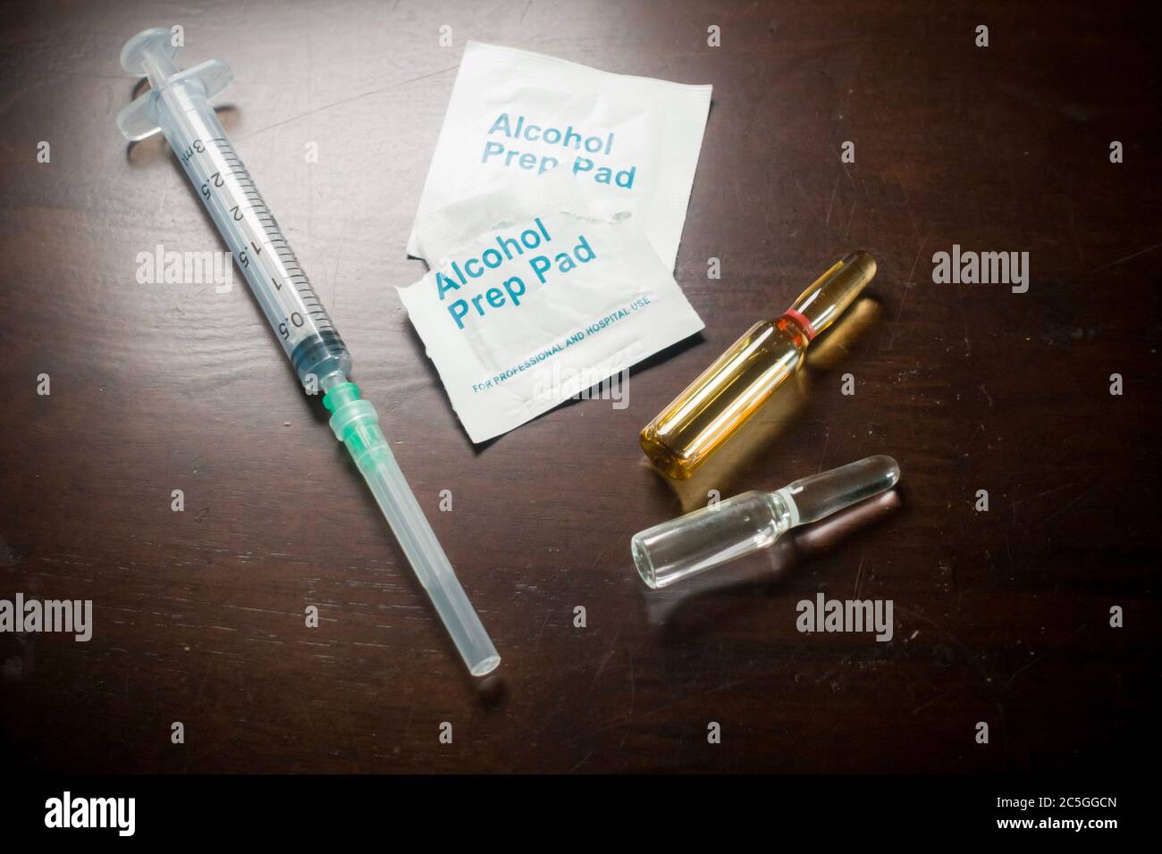 Medication ampoules for Intravenous injections on a wooden background ...