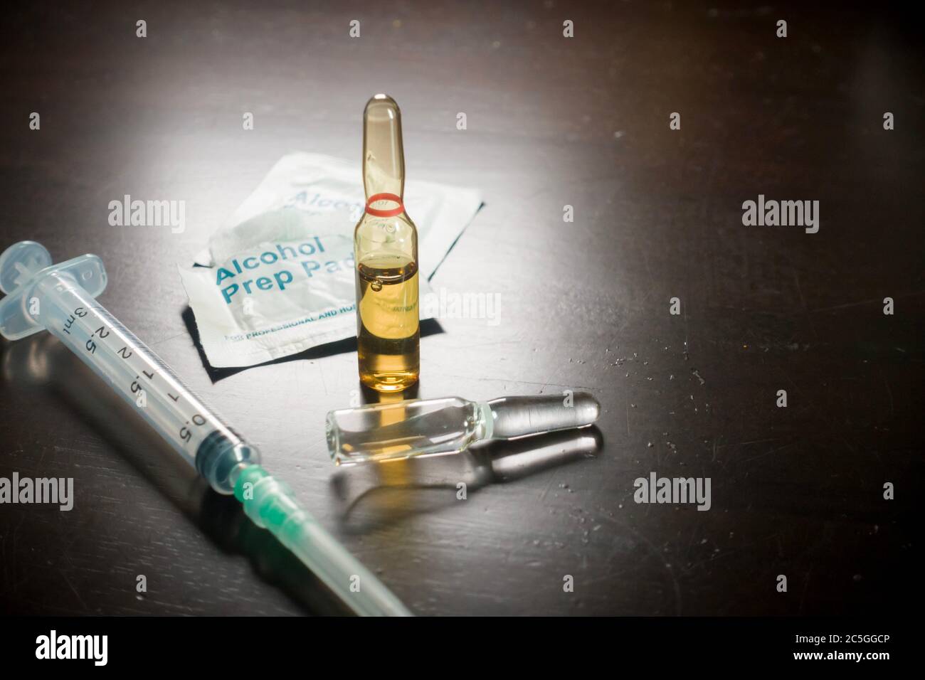 Medication ampoules for Intravenous injections on a wooden background ...