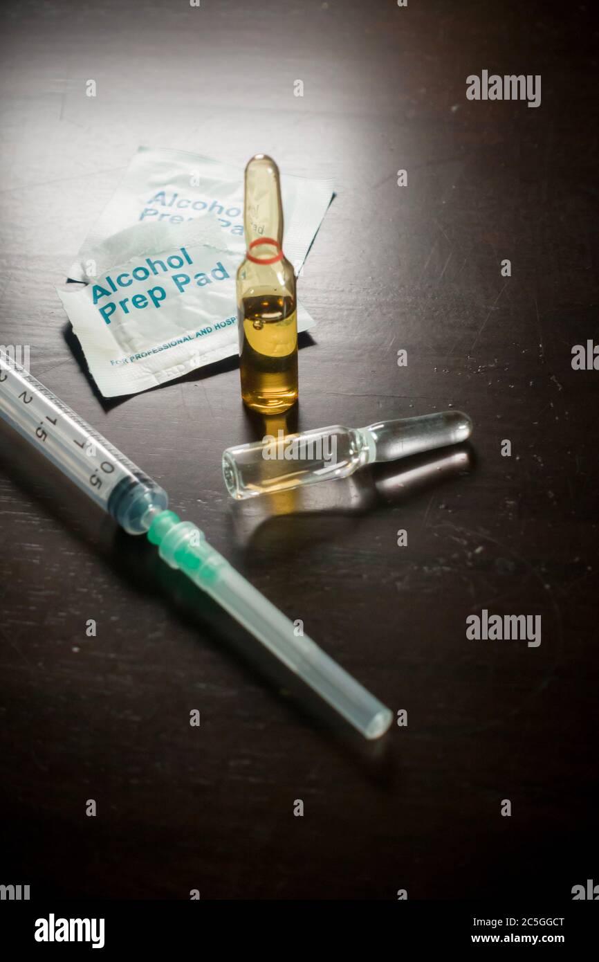 Medication ampoules for Intravenous injections on a wooden background ...