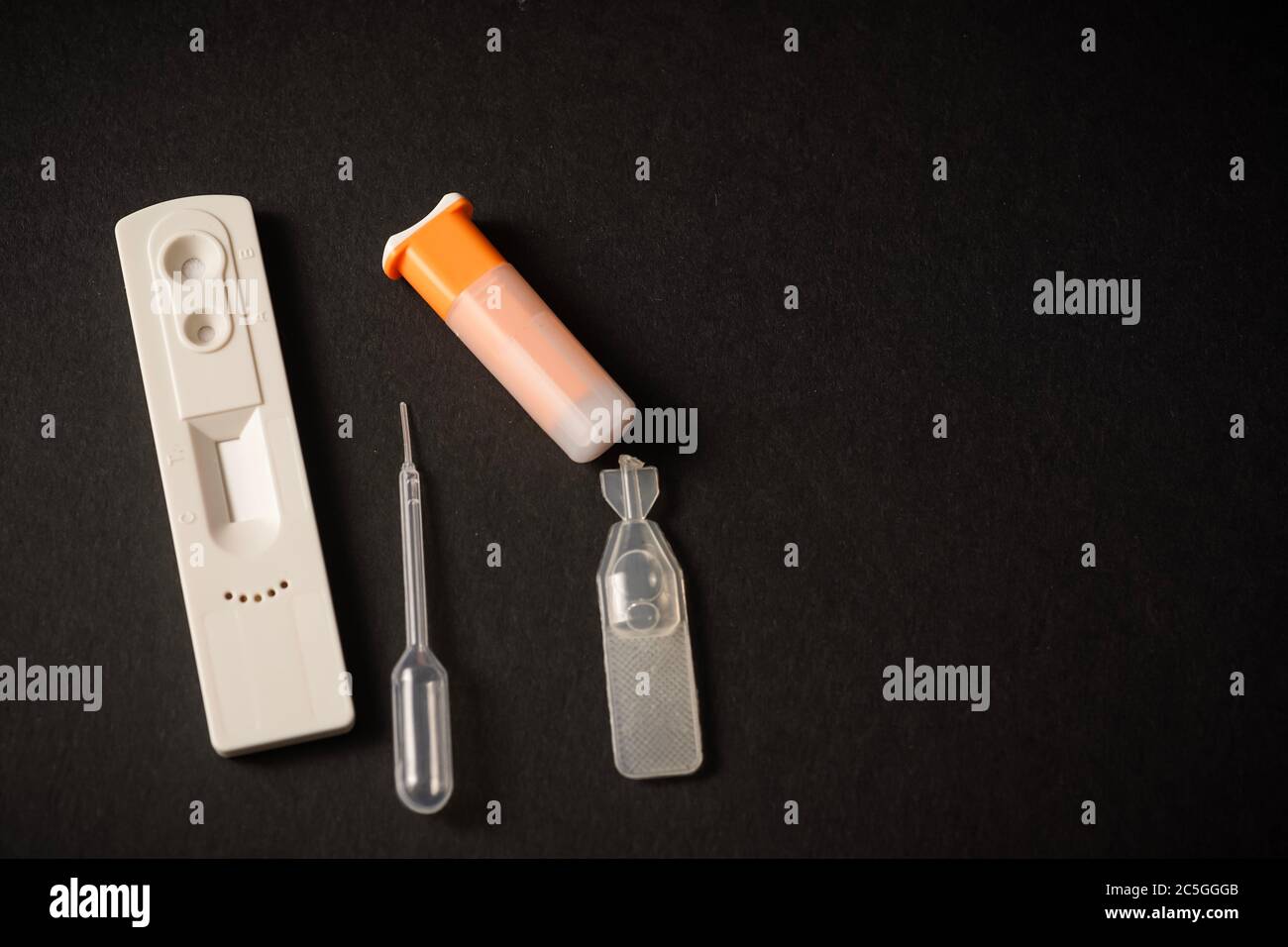 HIV rapid test kit on black background Stock Photo - Alamy