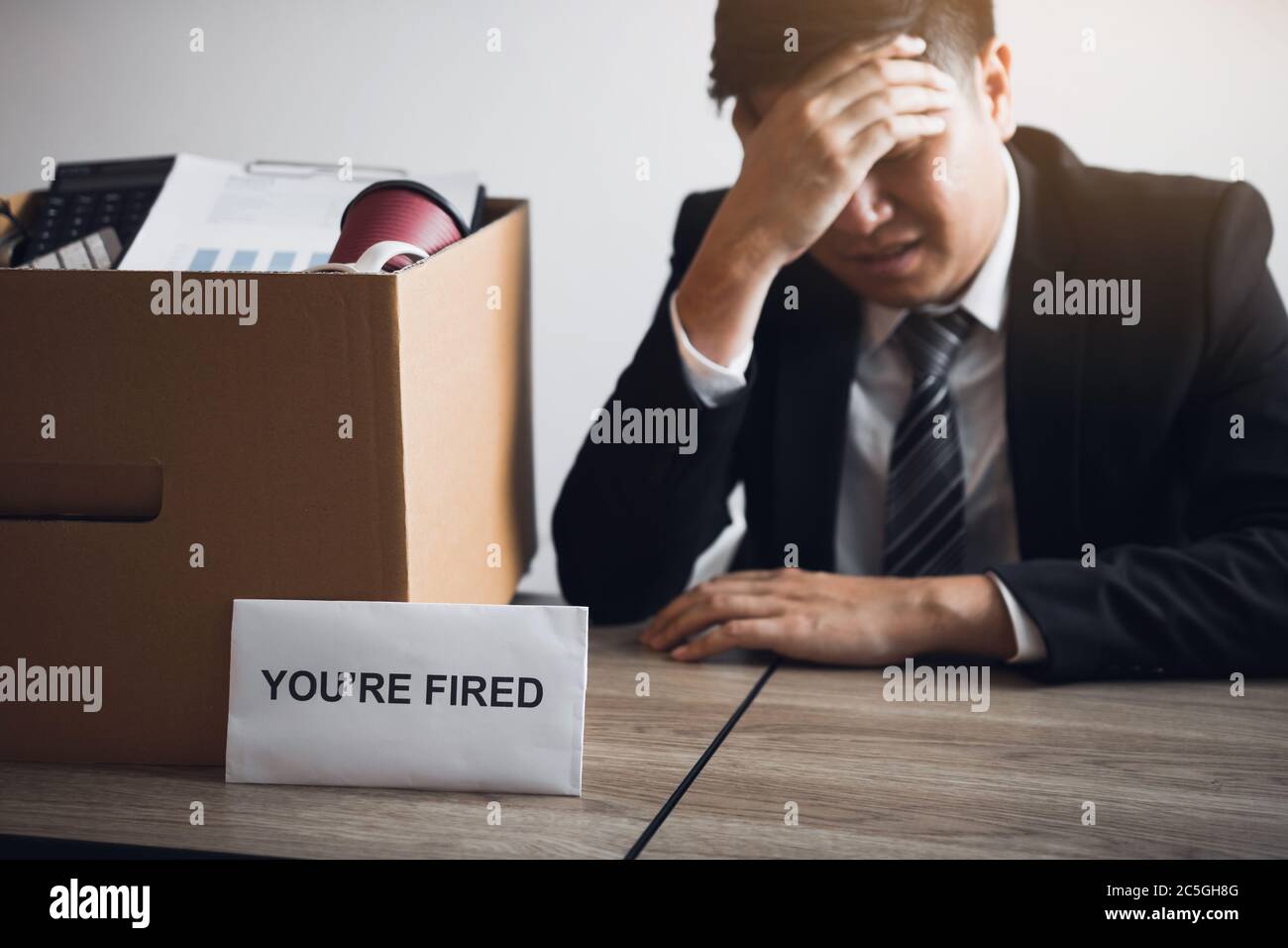 Male employee is stressed or angry while he is fired from being an ...