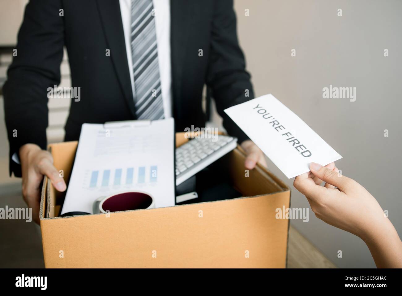 Female manager submits a resignation letter or envelope to the male ...