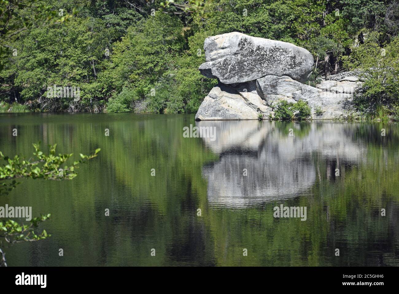 Boulder in a Lake Stock Photo - Alamy