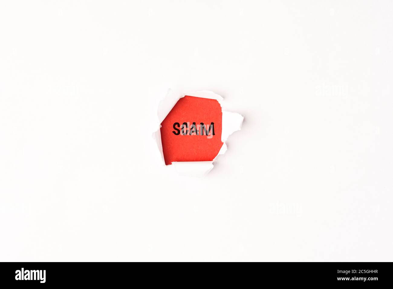 SCAM wording on a torn paper background Stock Photo - Alamy