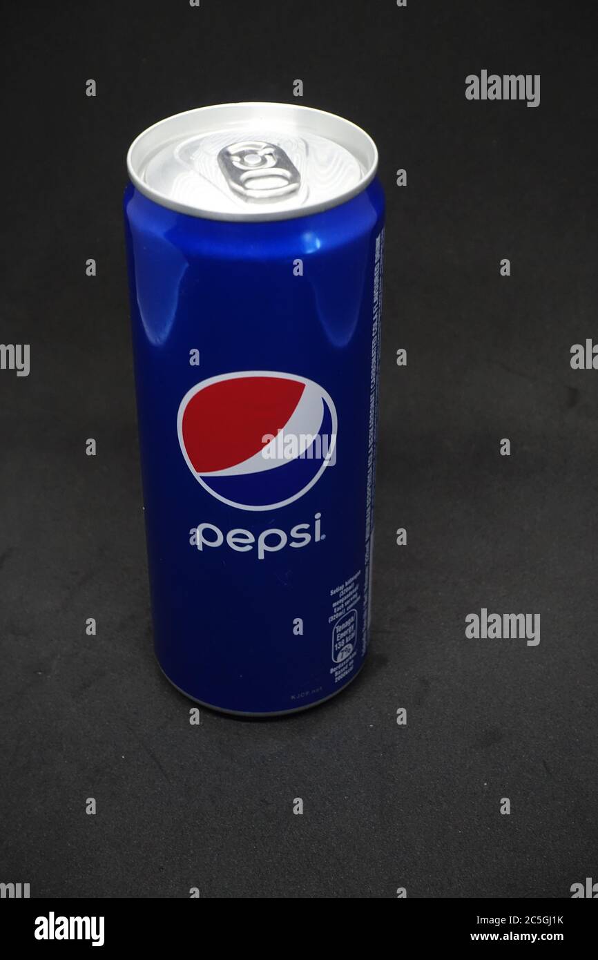 A can of blue pepsi against isolated black background Stock Photo - Alamy
