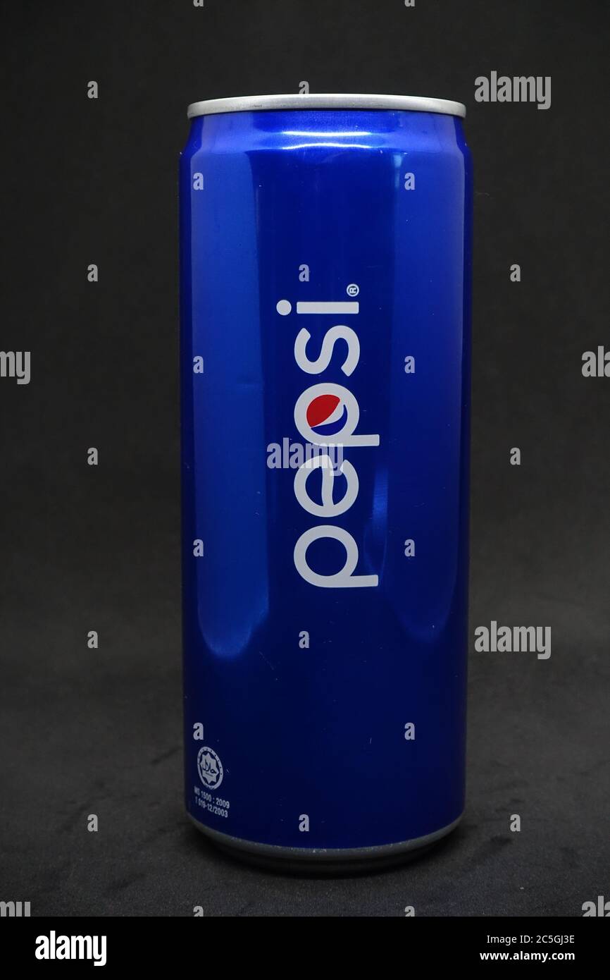 A can of blue pepsi against isolated black background Stock Photo - Alamy