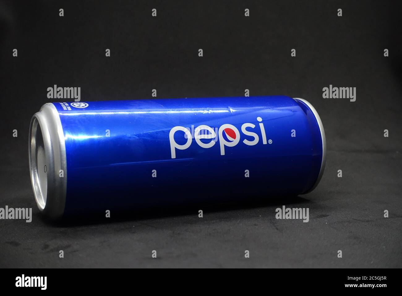 A can of blue pepsi against isolated black background Stock Photo - Alamy