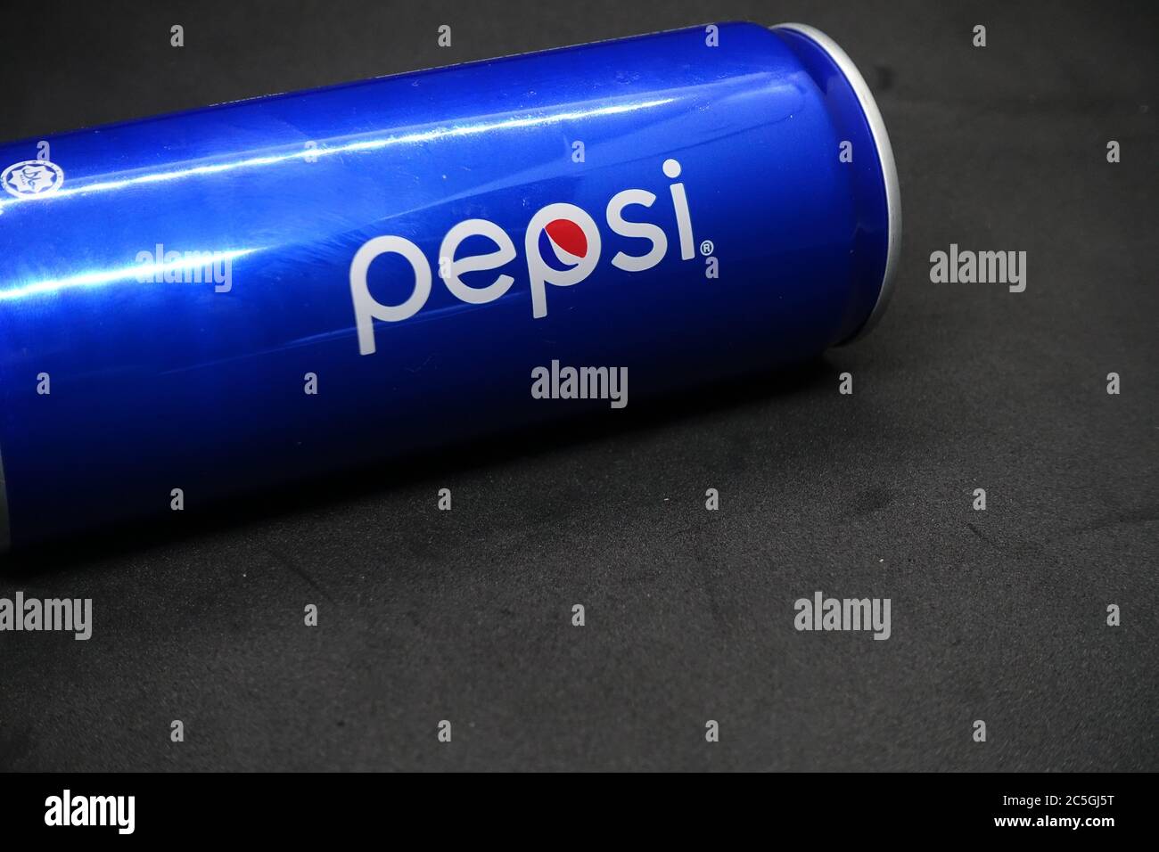 A can of blue pepsi against isolated black background Stock Photo - Alamy