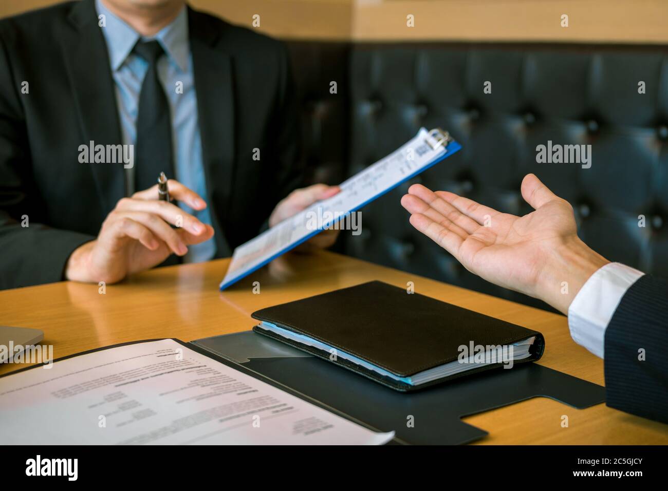 Interview in the office room with managers and employees talking about ...