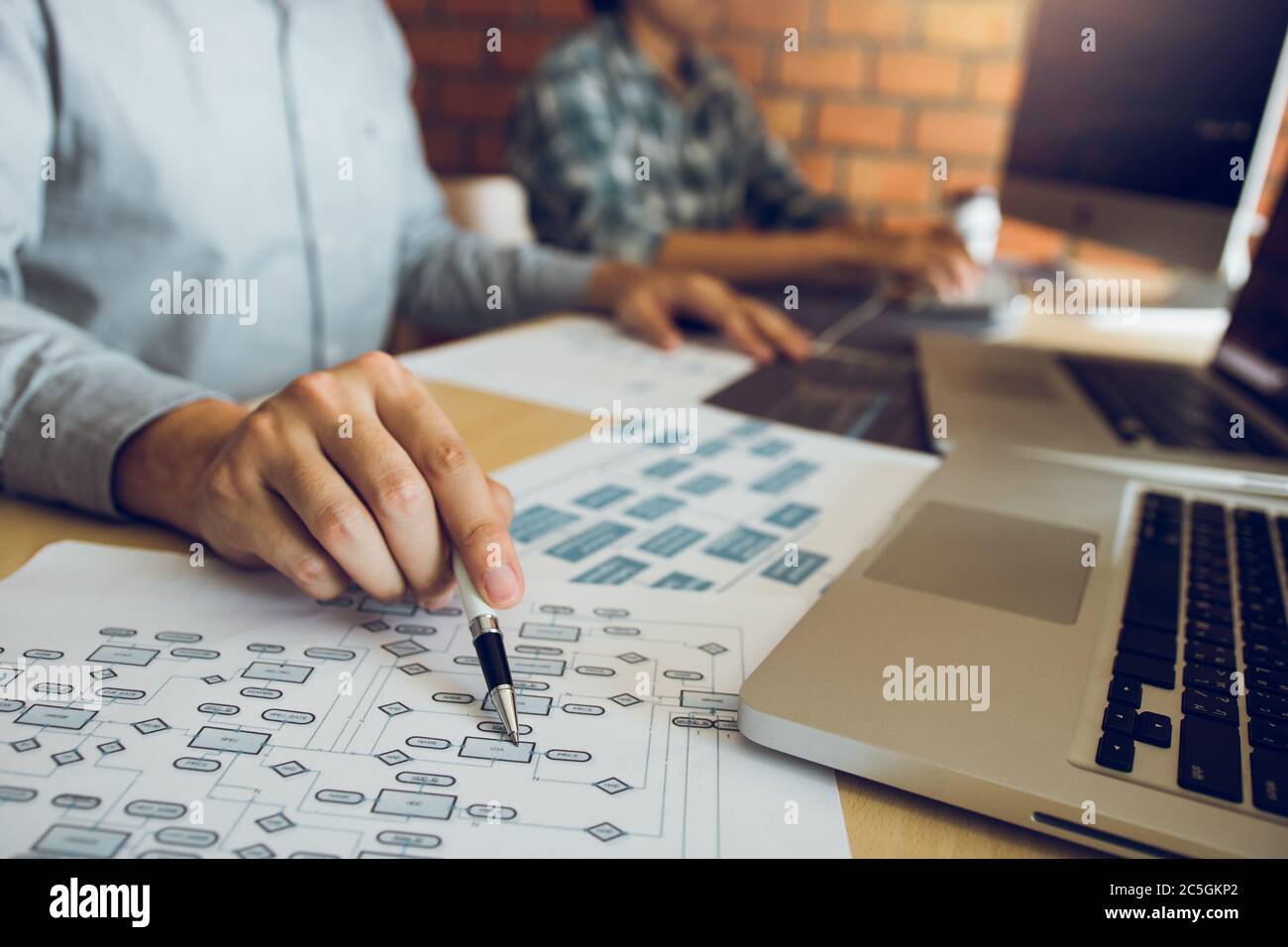 Programmer man pointing pen html hi-res stock photography and images ...