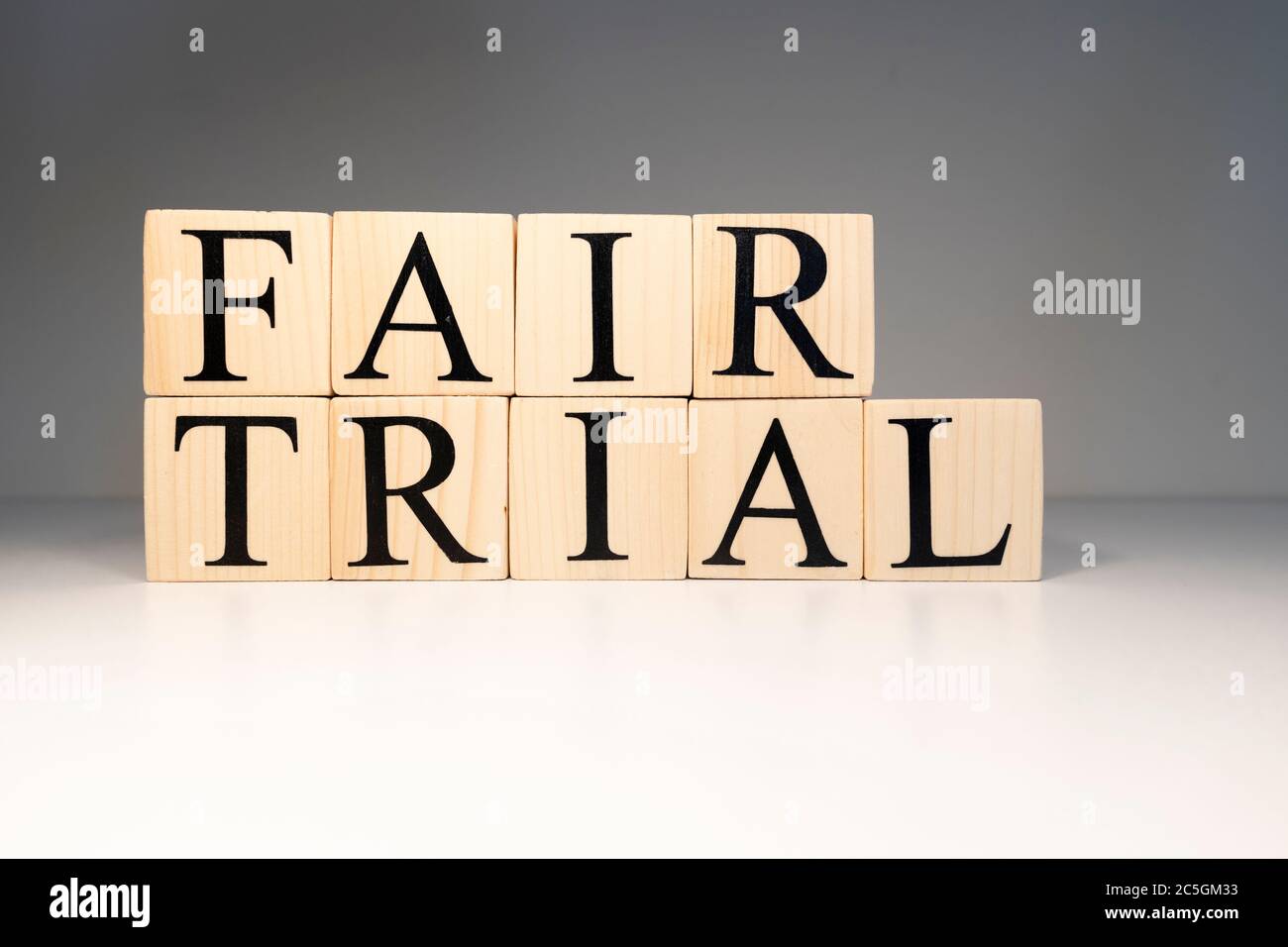 Fair trial word from wooden cubes. About law terms Stock Photo - Alamy