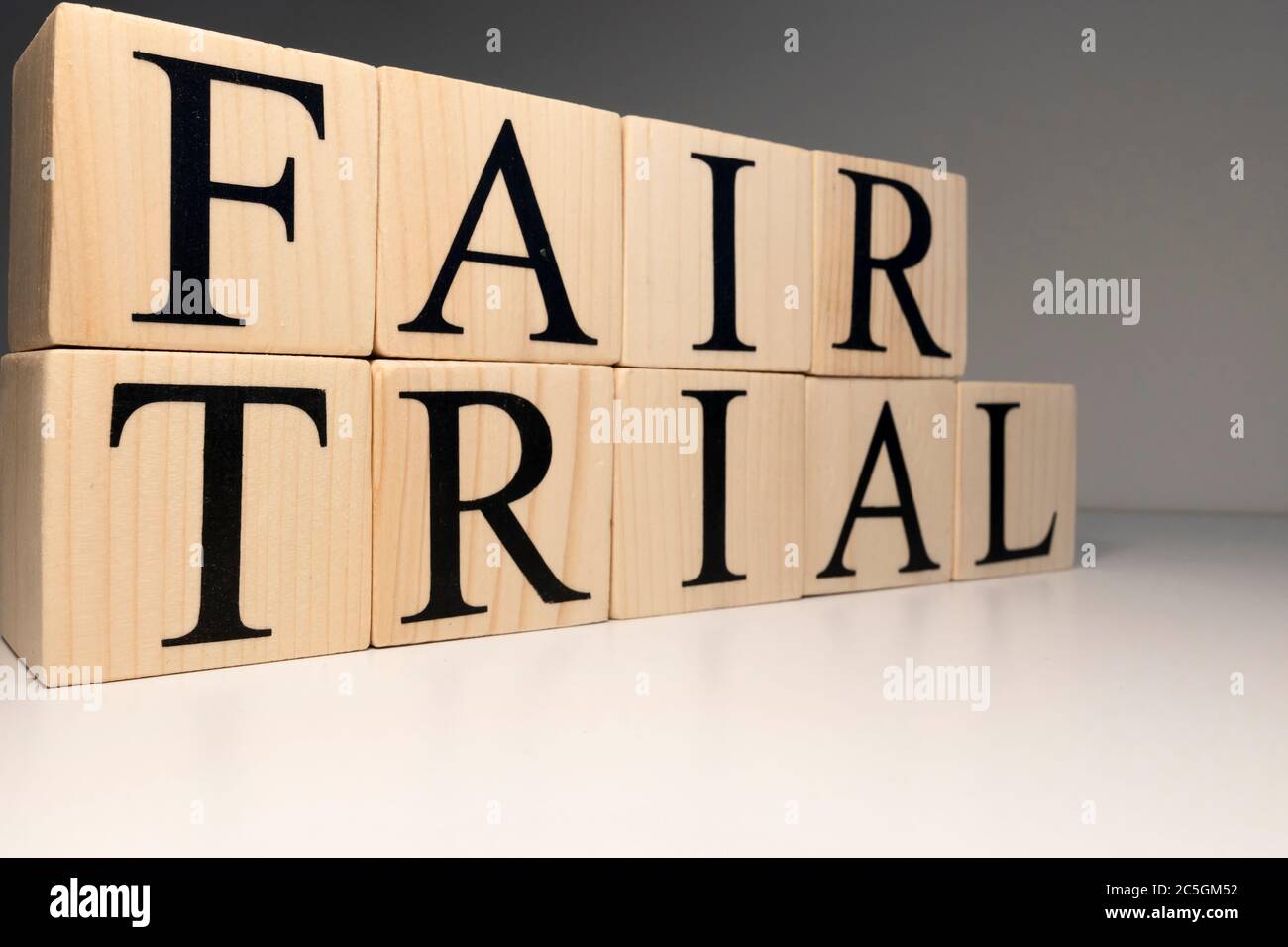 Fair trial word from wooden cubes. About law terms Stock Photo - Alamy